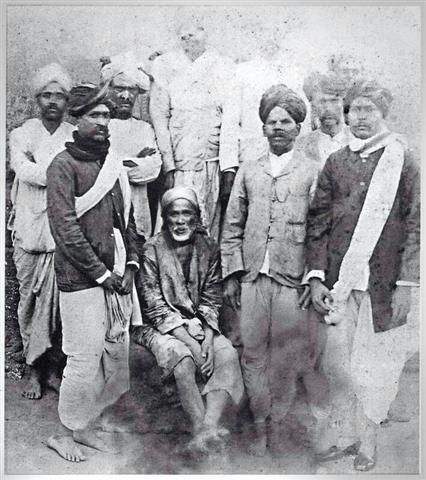 Original photograph of Baba giving Udi to devotees